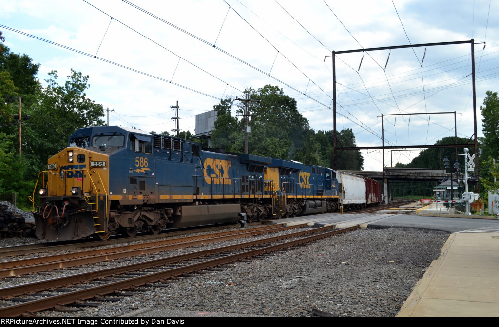 CSX CW44AHs 586 and CSX ES44AH 719 lead Q418-10 out of Woodbourne Yard.